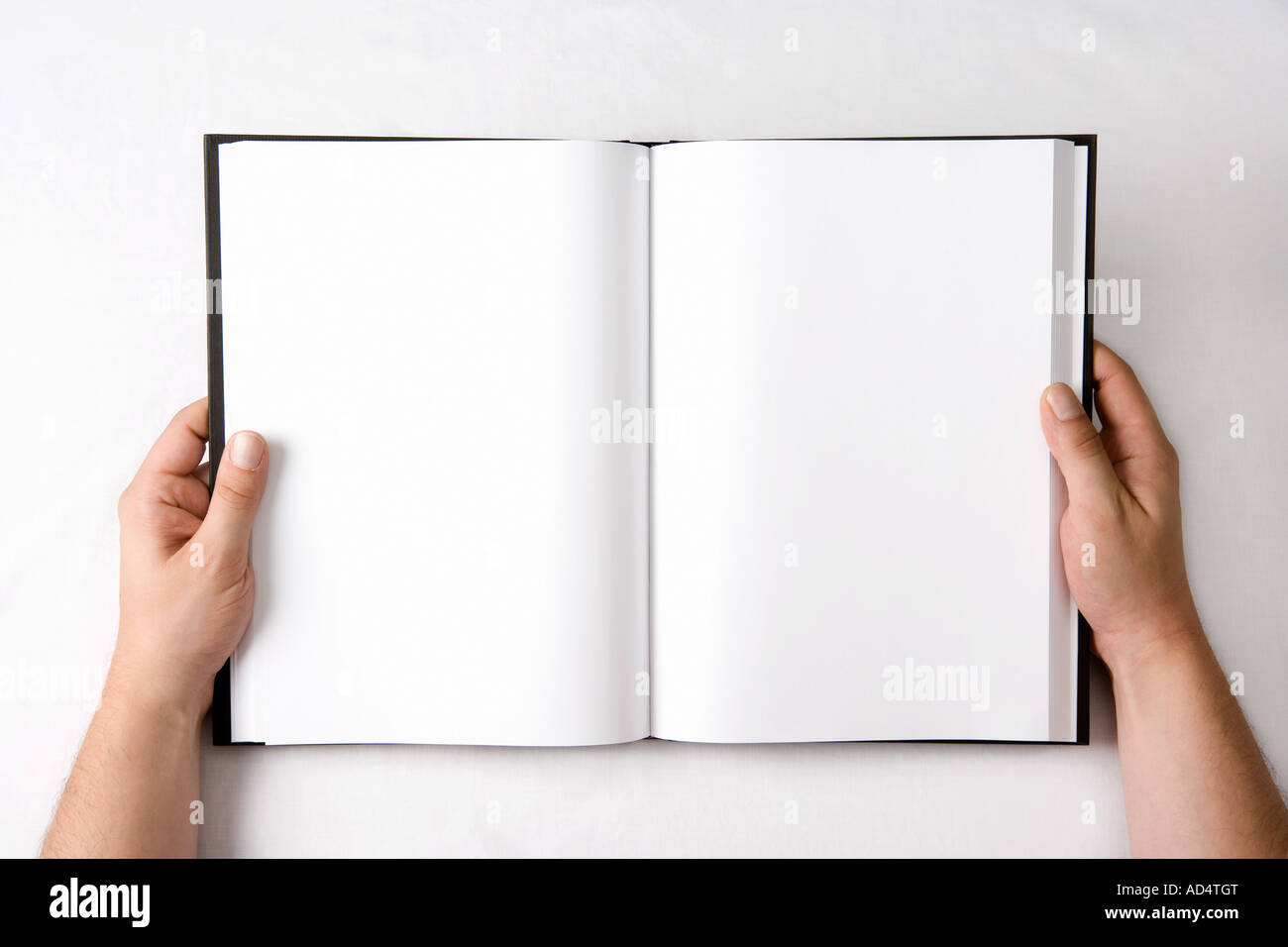 Holding an open book hi-res stock photography and images - Alamy