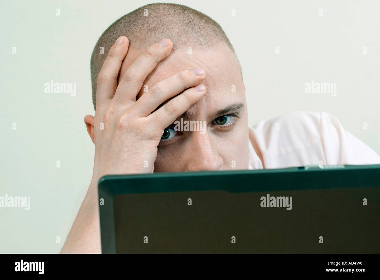 A man staring at a laptop Stock Photo - Alamy