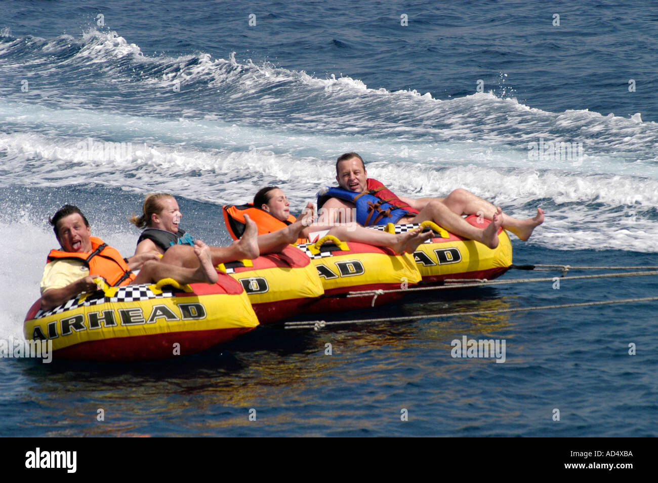 Group enjoy riding the donuts Stock Photo - Alamy