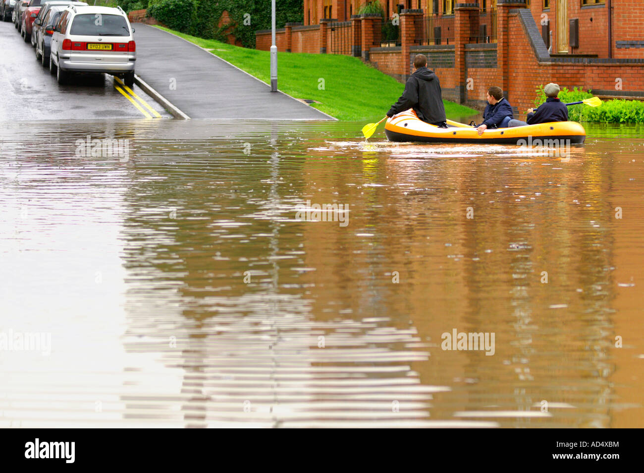 Child flooding dinghy flood road hi-res stock photography and images ...