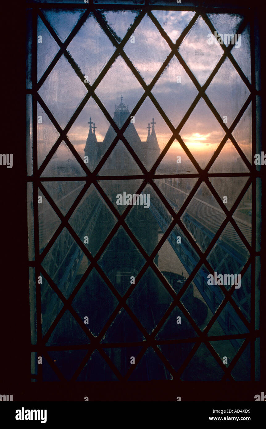 Tower Bridge seen through the weathered leaded light window of the ...