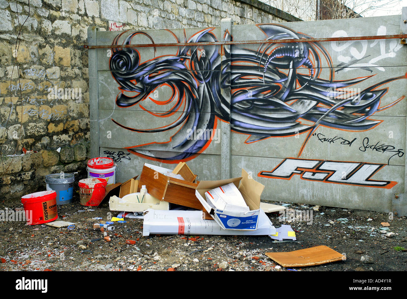 Graffiti and trash thrown on the ground Stock Photo - Alamy