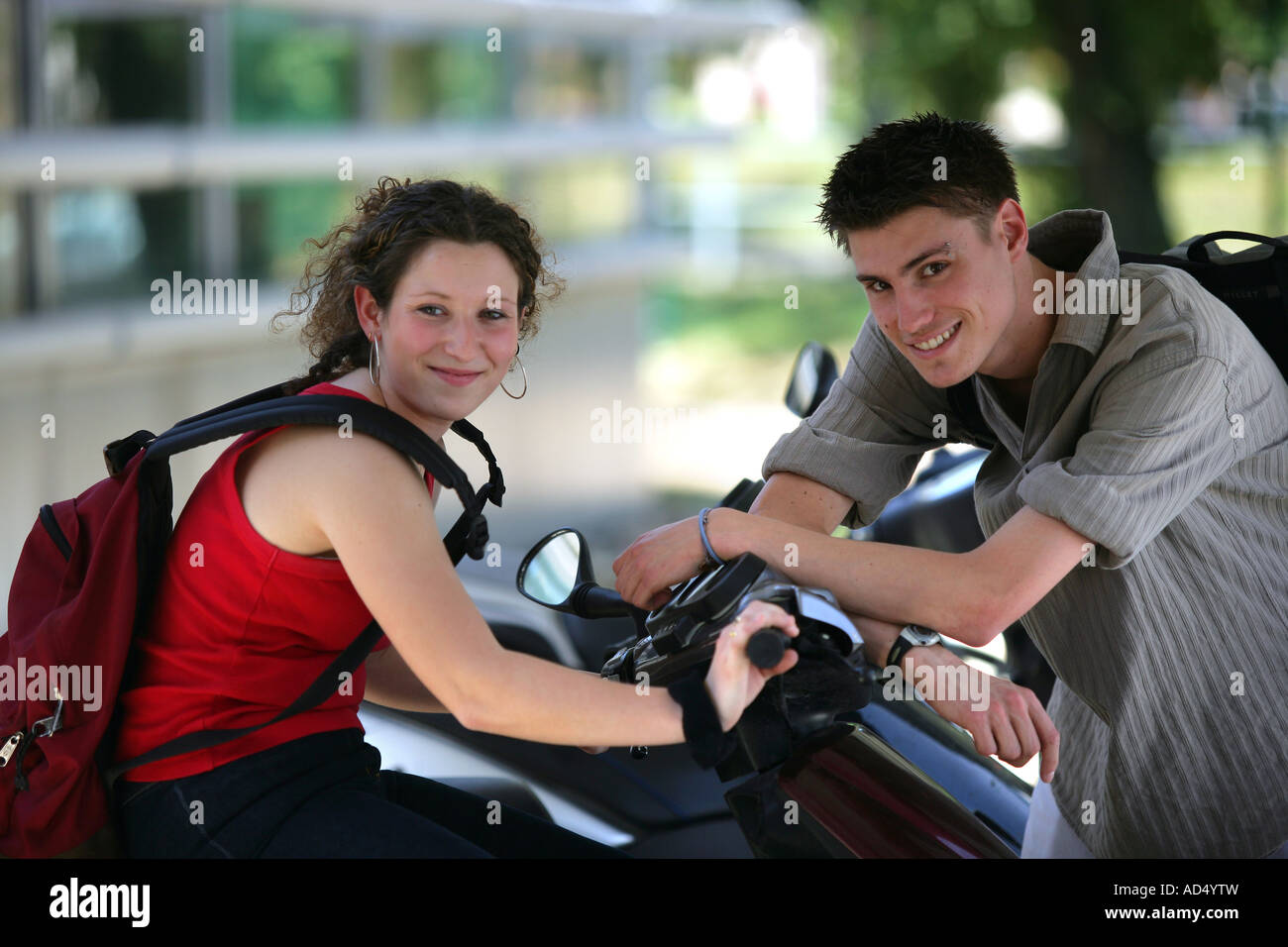 Students on a motor scooter Stock Photo - Alamy