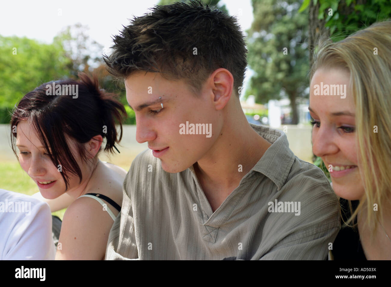 Students sitting on the ground Stock Photo - Alamy