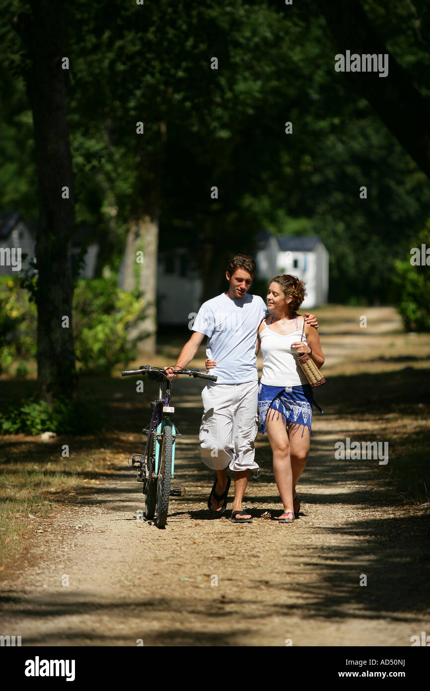 Young couple walking Stock Photo - Alamy