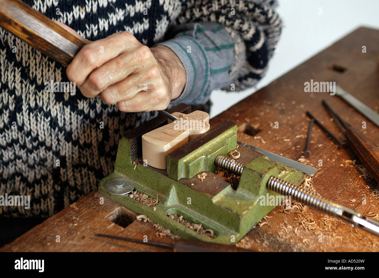 Man shaping a piece of wood Stock Photo - Alamy
