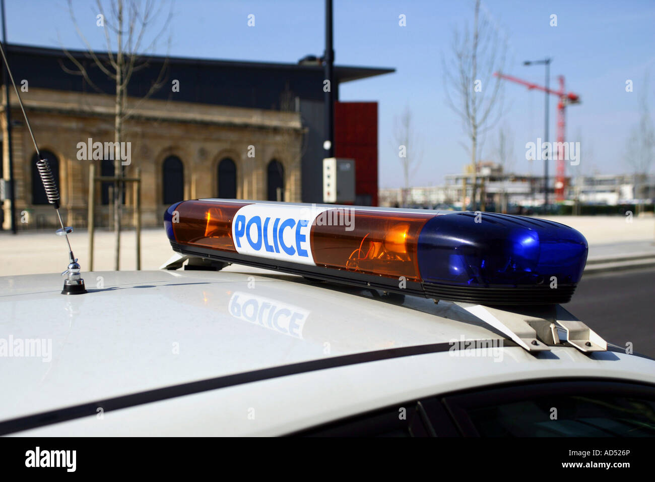 Police car patrolling Stock Photo - Alamy