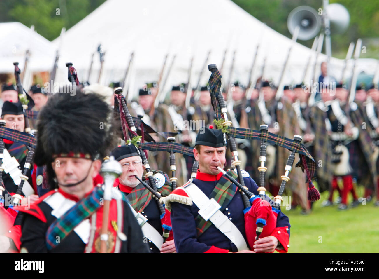 Atholl Highlanders pipe band and soldiers marching past Duke of Atholl ...