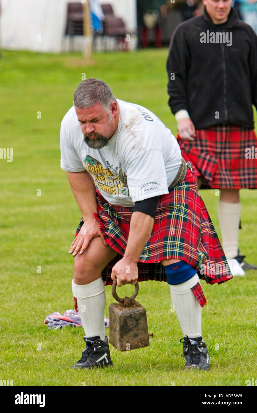 Throwing heavy weight over high bar at 2006 Atholl Gathering Highland ...