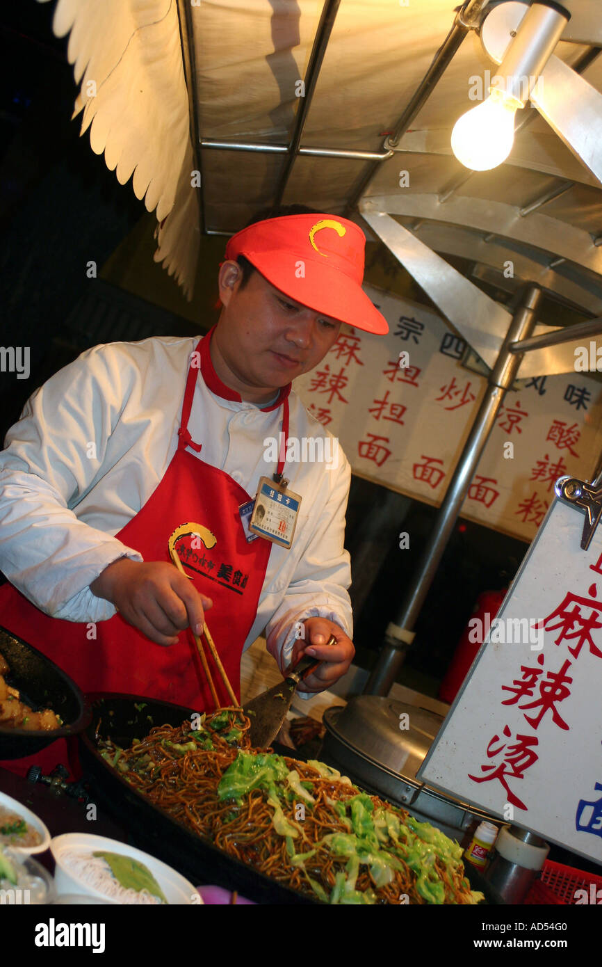 Selling noodles and other delicacies at Beijing's night food market off ...