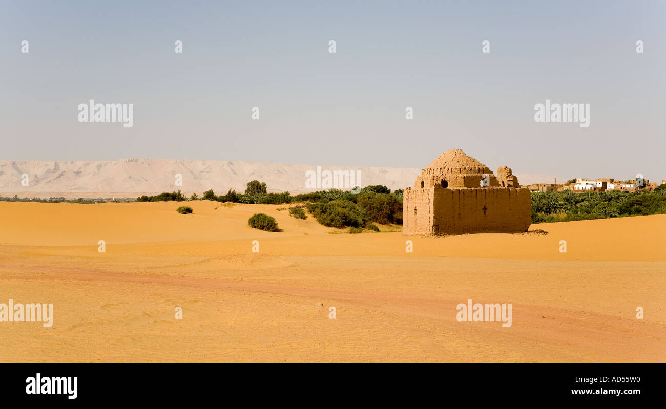 Small shrine against green trees and escarpment. Bahariya Oasis. Egypt ...