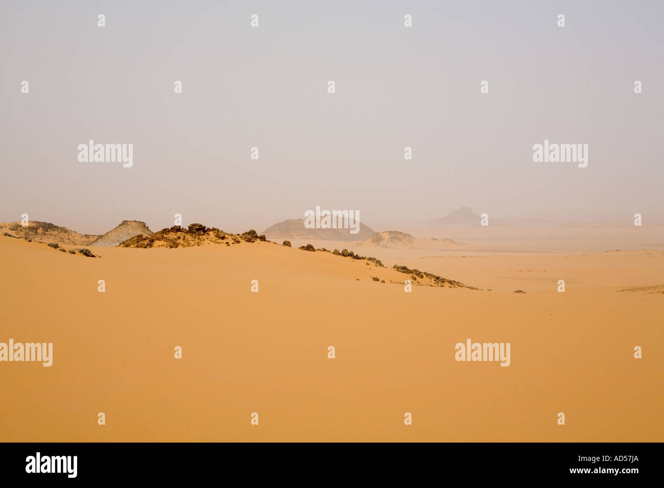 Sand plain in haze of approaching storm en route to the Gilf Kebir ...