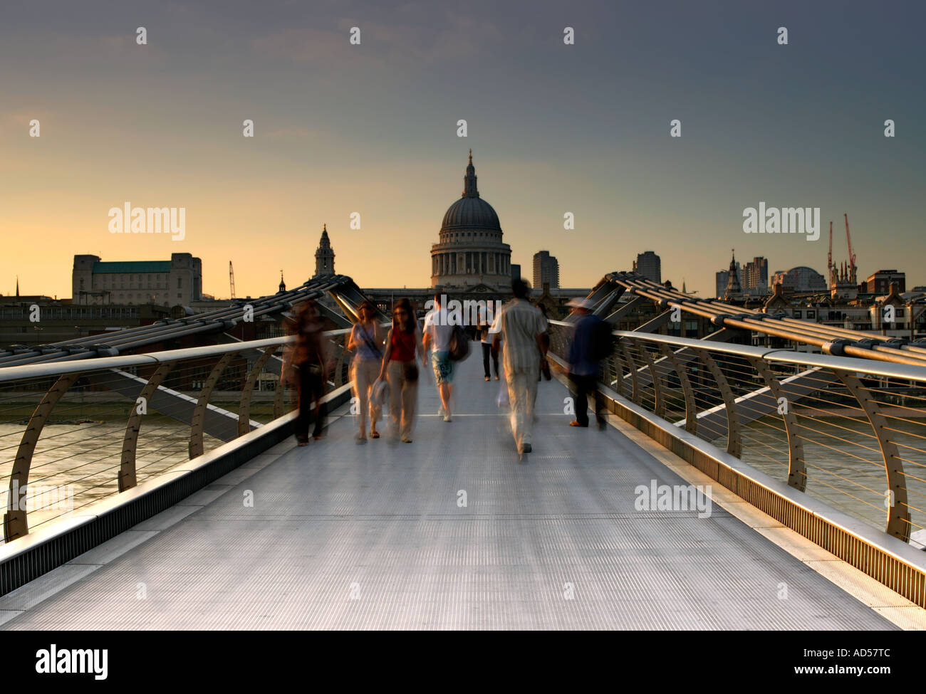 Blurred People walking on London's Millennium Bridge Stock Photo - Alamy