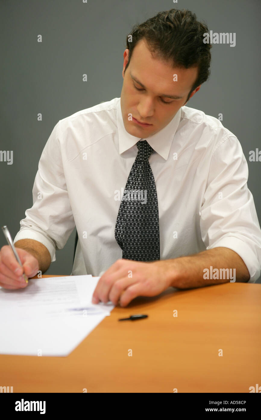 Young professional writing Stock Photo - Alamy