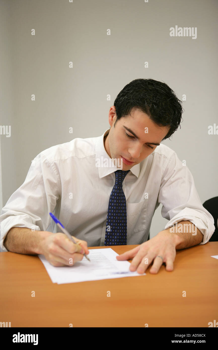 Young professional writing Stock Photo - Alamy