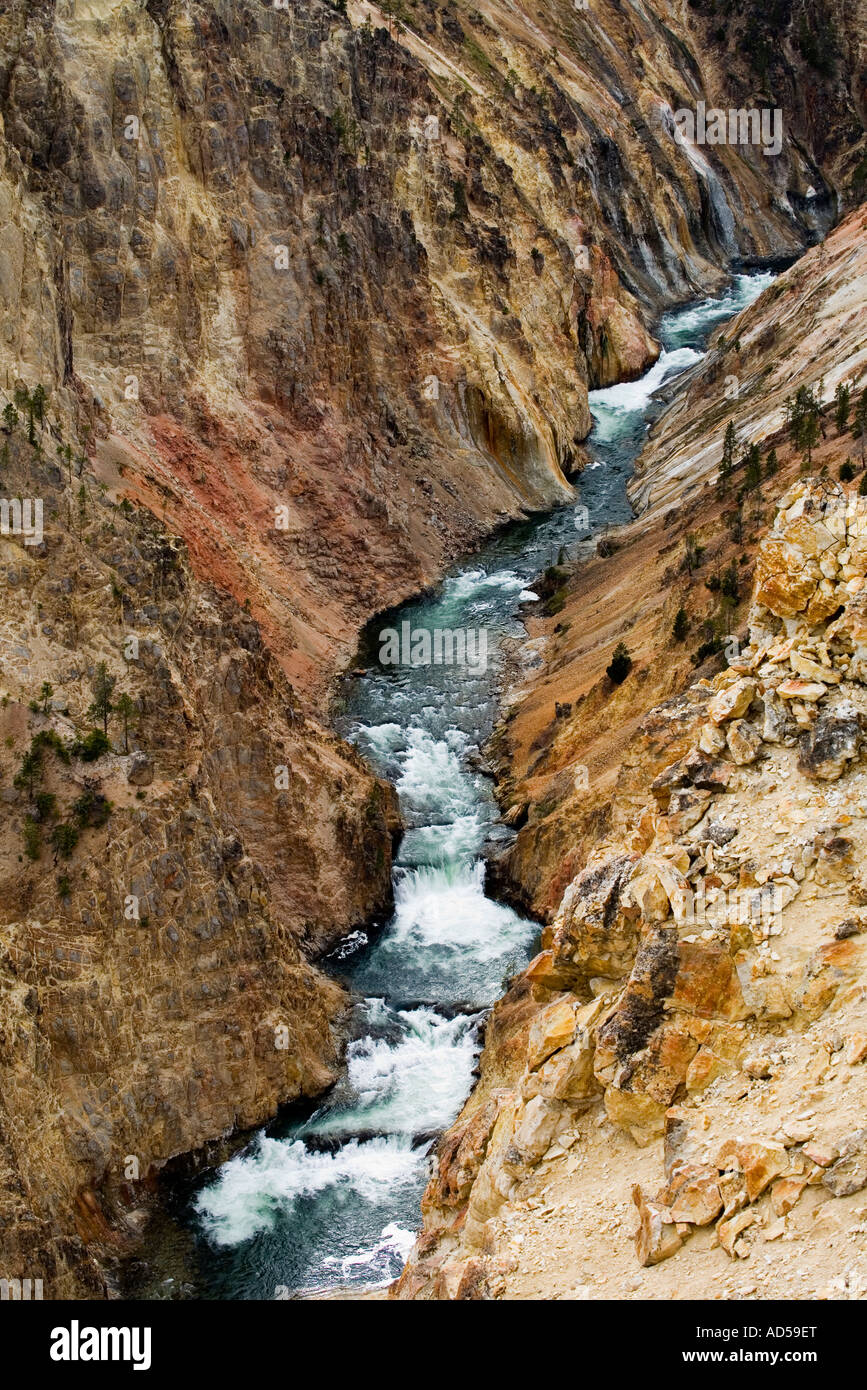 The Yellowstone River and canyon, the multi colored rock formations ...
