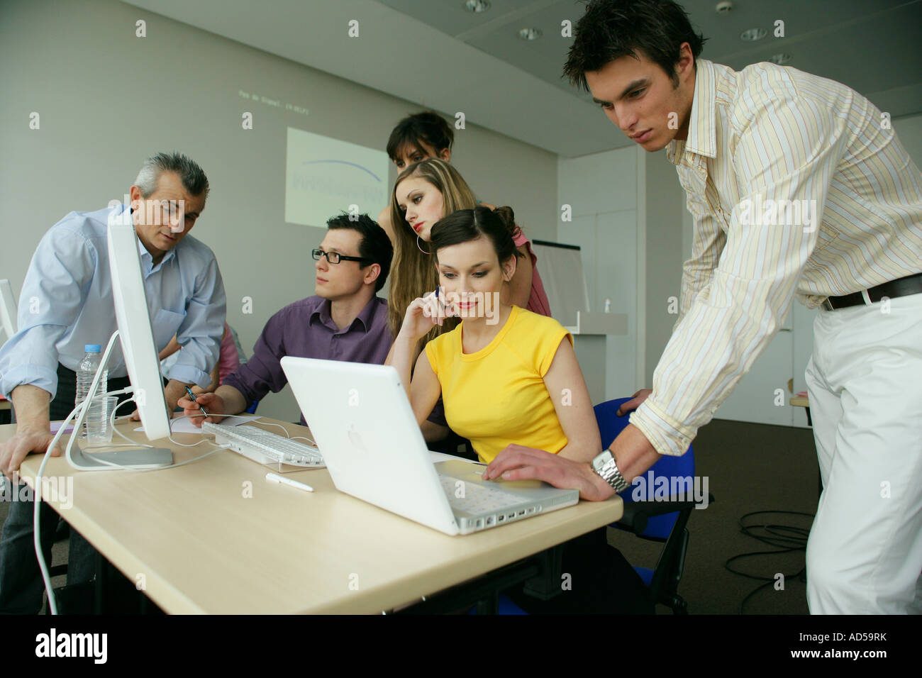 Young professionals using computers Stock Photo - Alamy