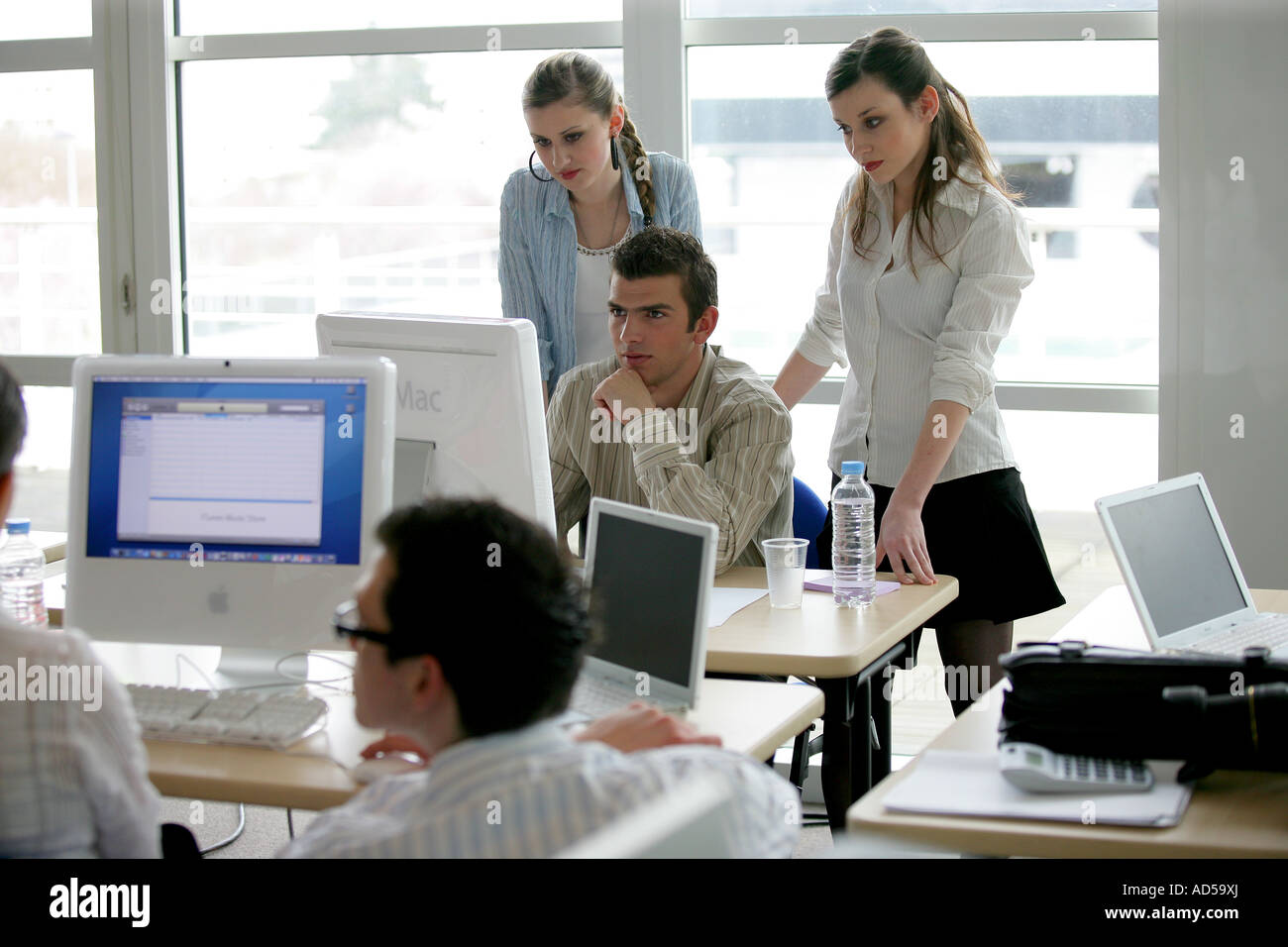 Young professionals using computers Stock Photo - Alamy