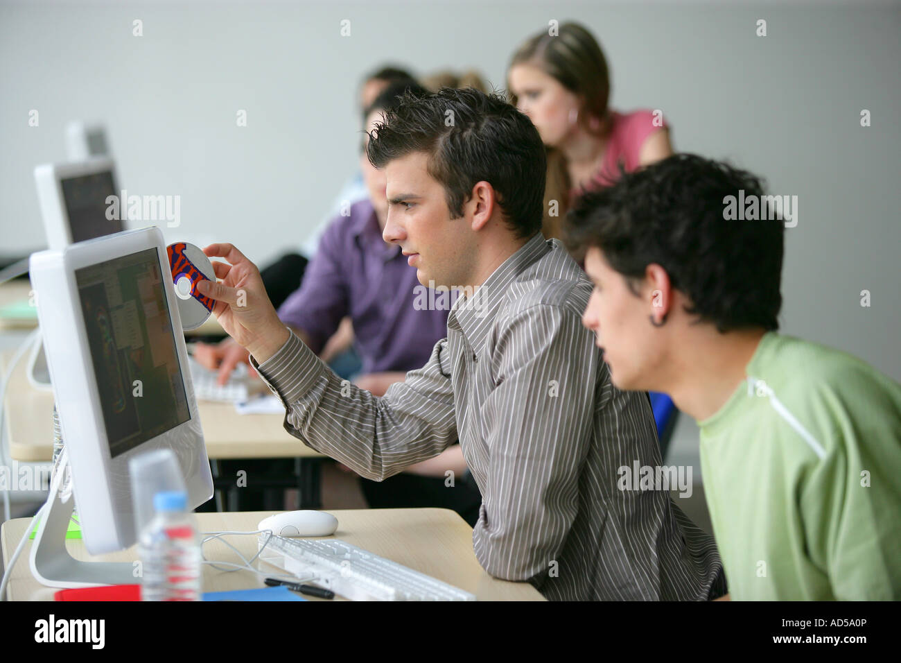 Young professionals using computers Stock Photo - Alamy
