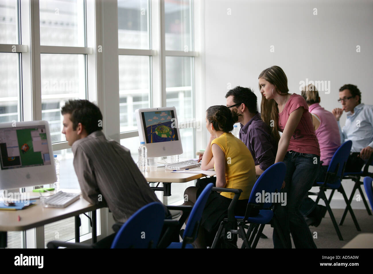 Young professionals using computers Stock Photo - Alamy