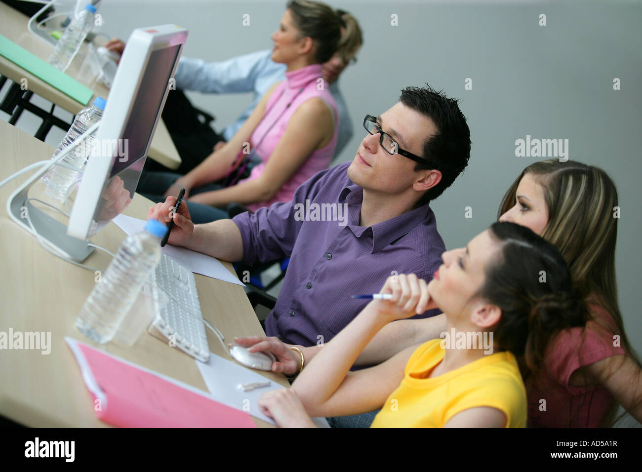 Young professionals using computers Stock Photo - Alamy