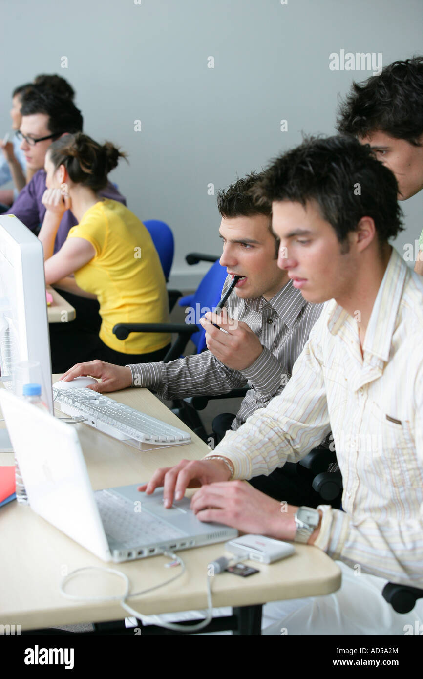 Young professionals using computers Stock Photo - Alamy