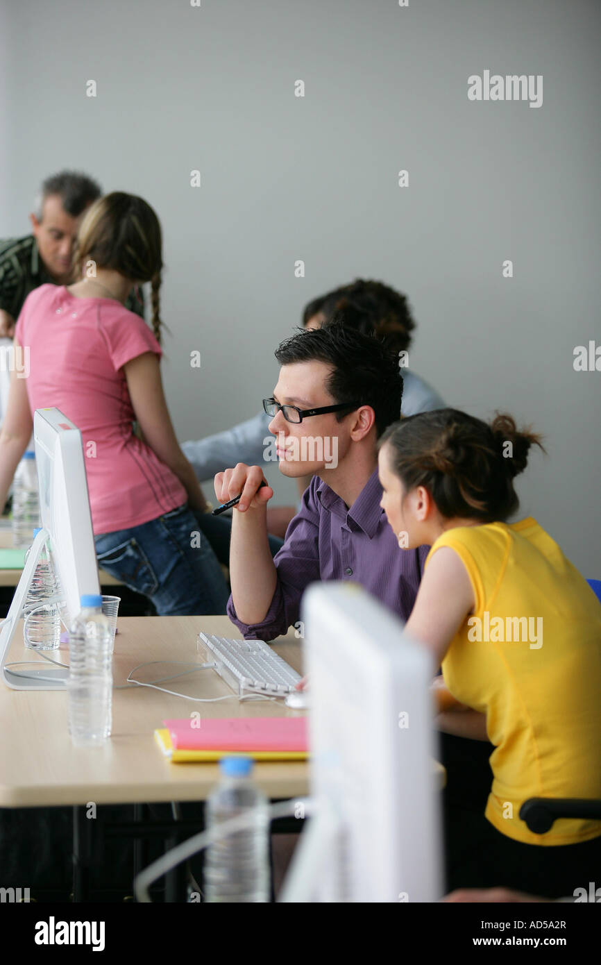 Young professionals using computers Stock Photo - Alamy