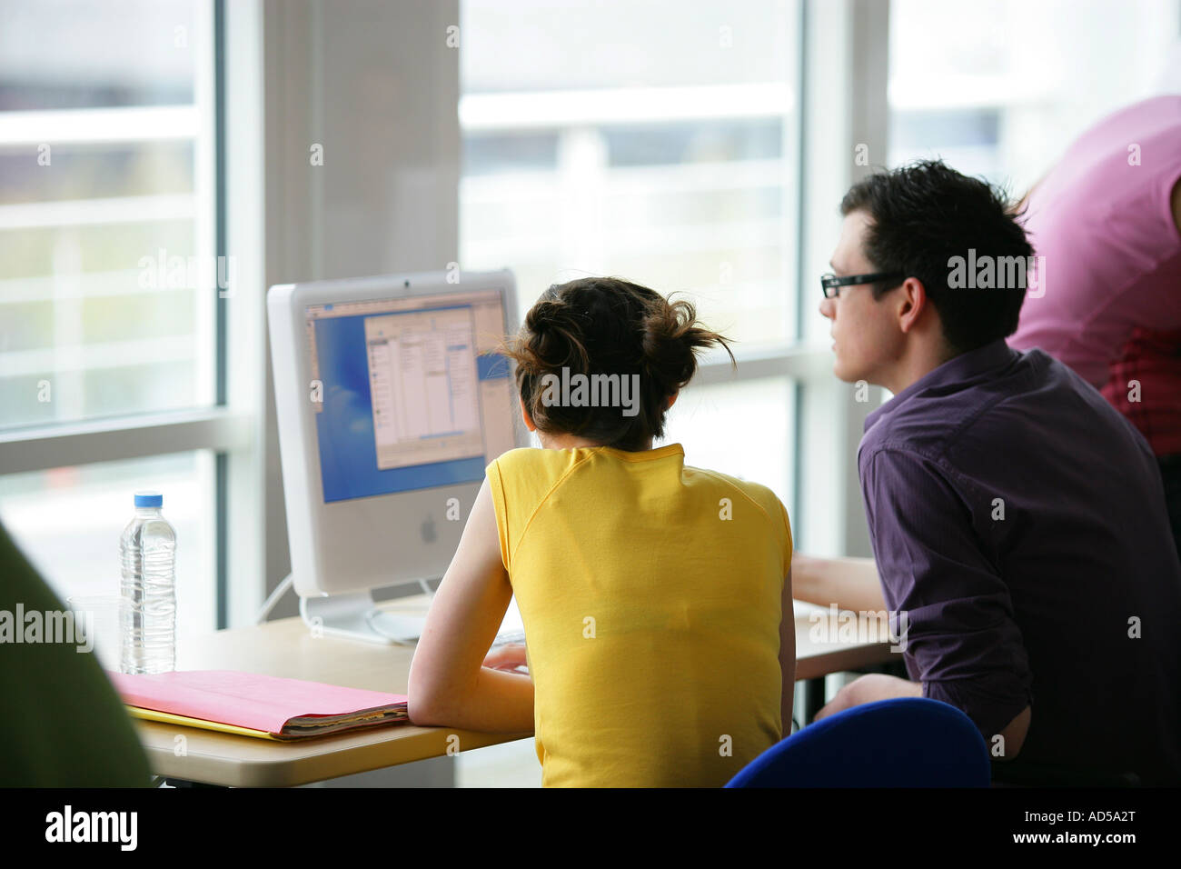 Young professionals using computers Stock Photo - Alamy