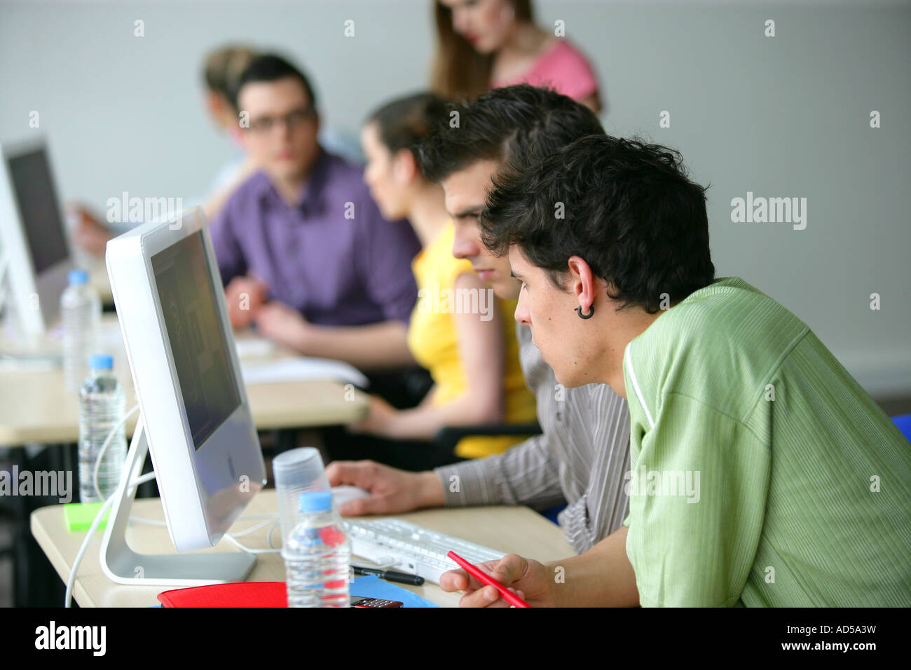 Young professionals using computers Stock Photo - Alamy
