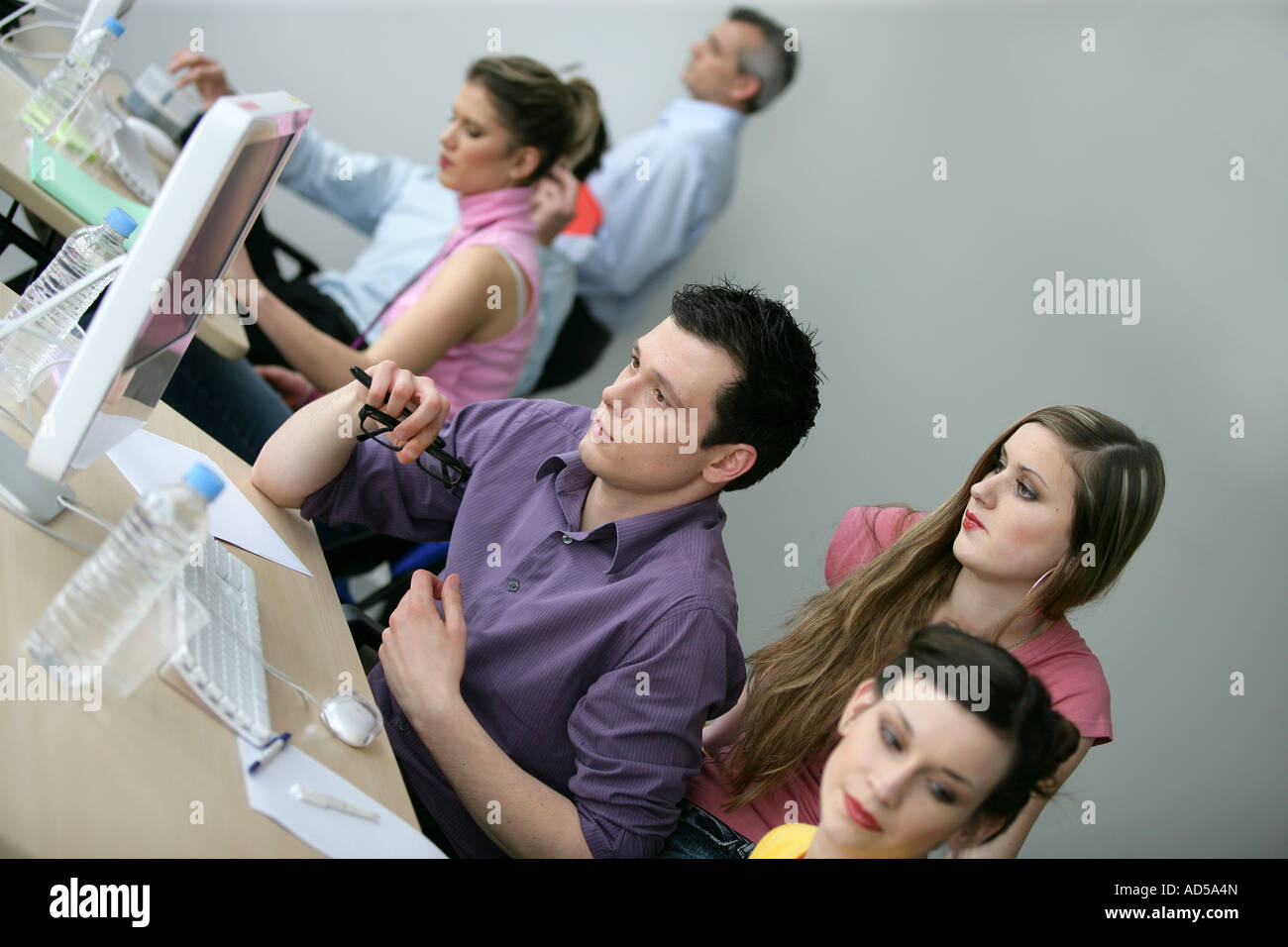 Young professionals using computers Stock Photo - Alamy