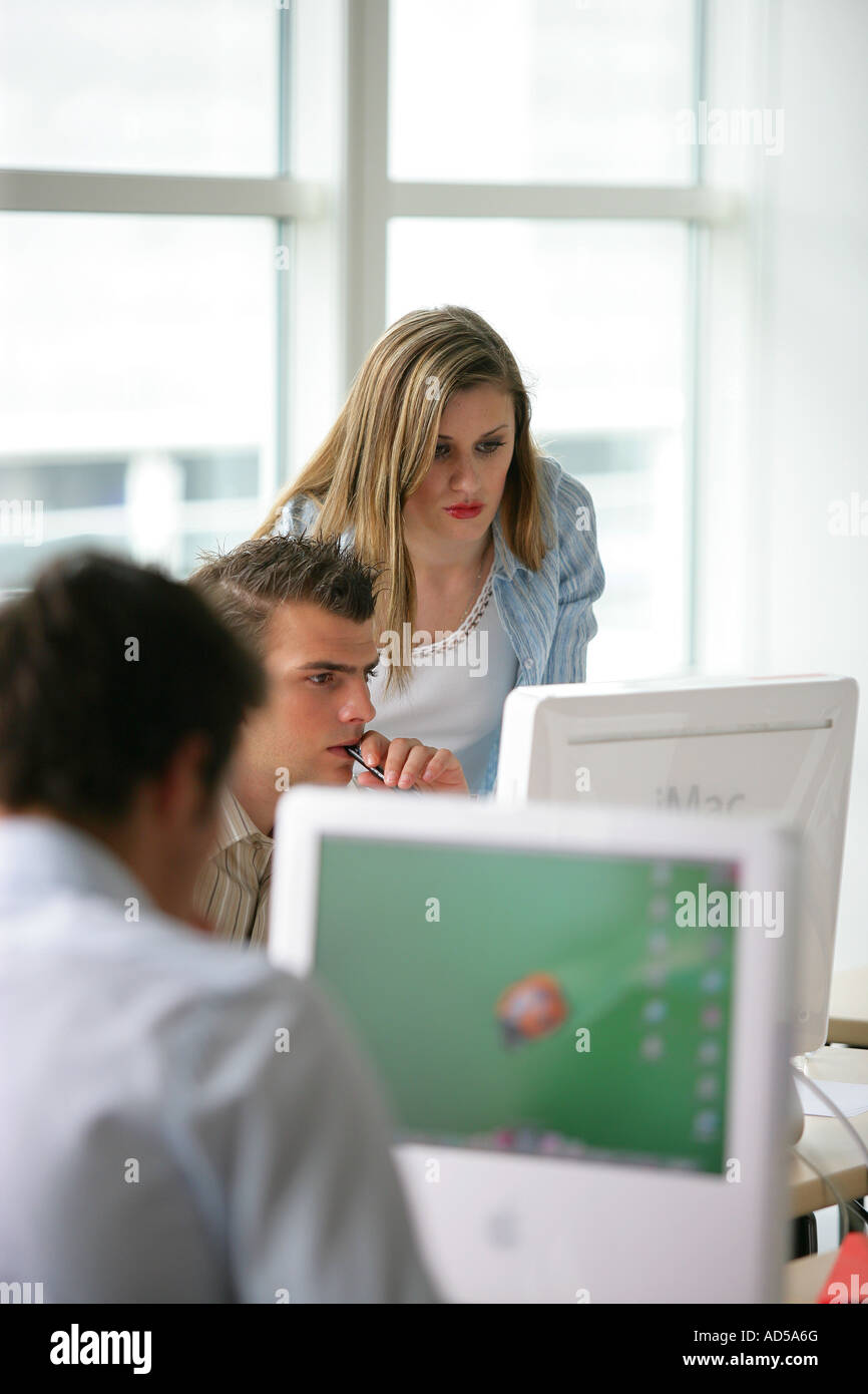 Young professionals using computers Stock Photo - Alamy
