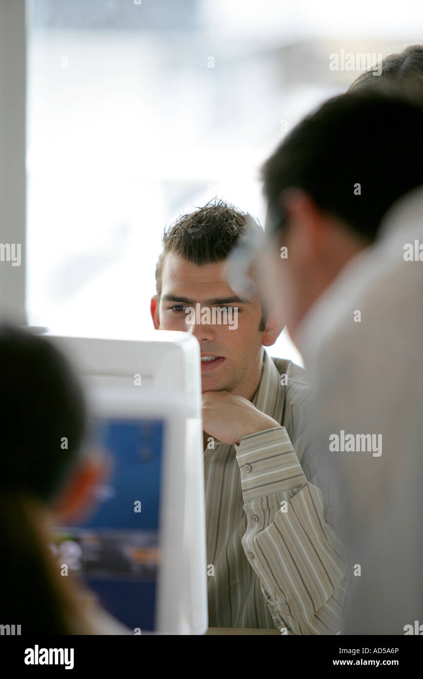 Young professionals using computers Stock Photo - Alamy