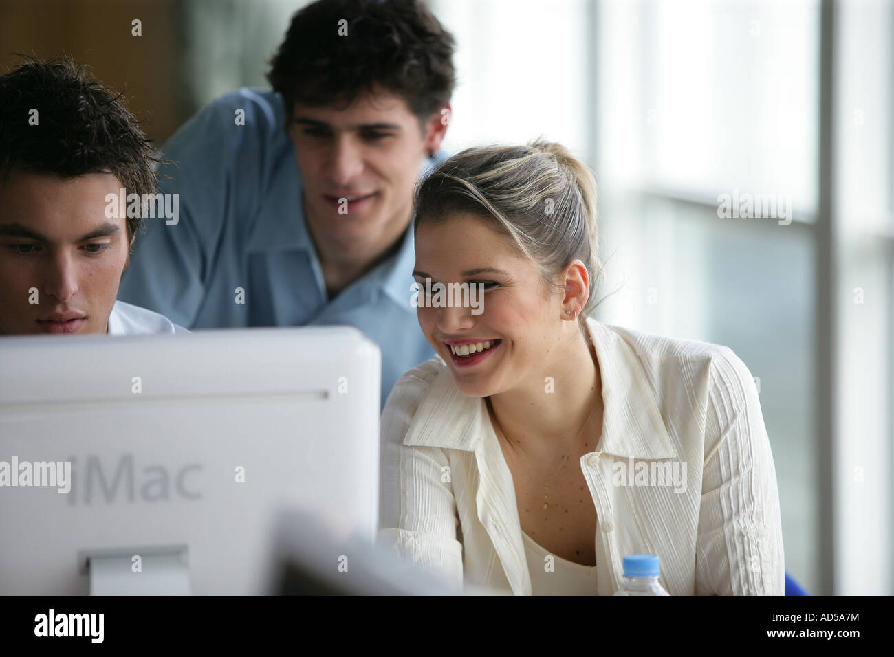 Young professionals using computers Stock Photo - Alamy