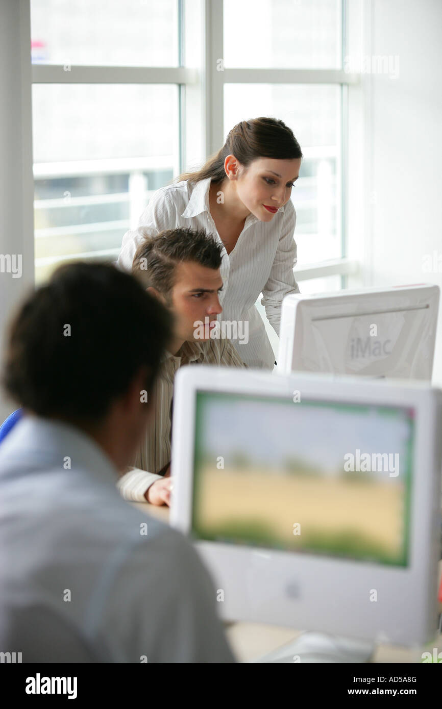 Young professionals using computers Stock Photo - Alamy