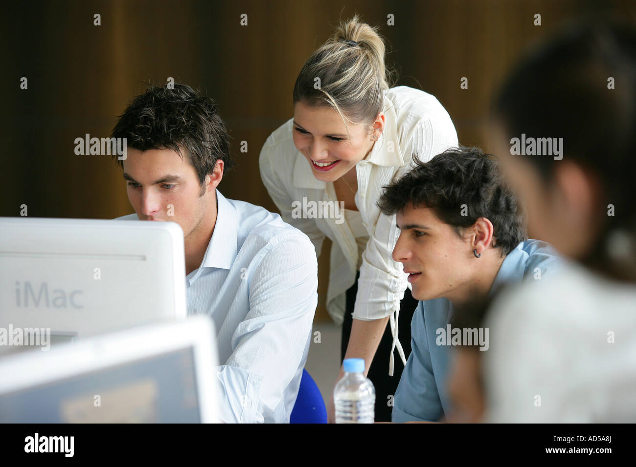 Young professionals using computers Stock Photo - Alamy