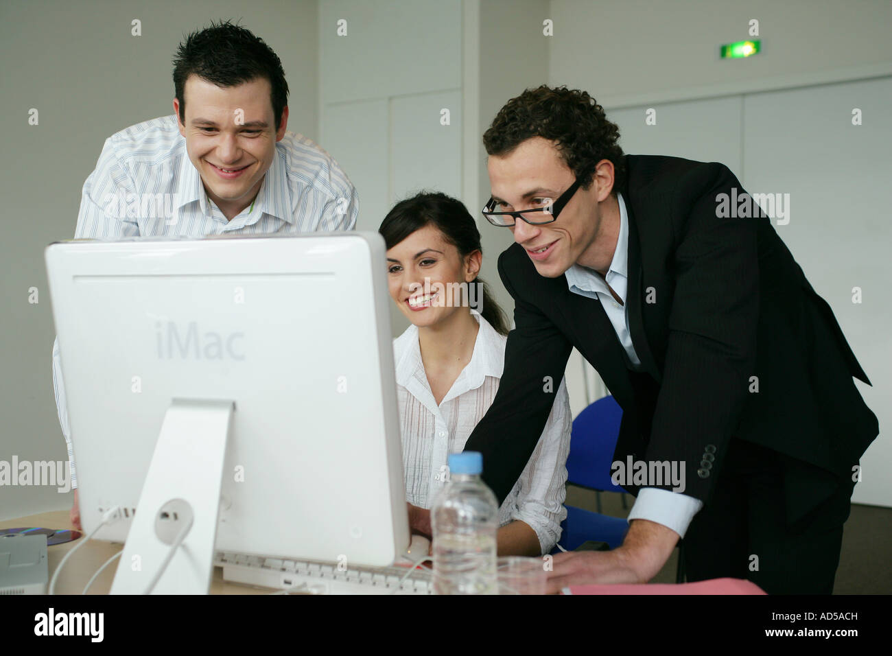 Young professionals using computers Stock Photo - Alamy