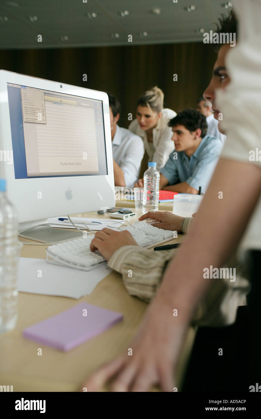 Young professionals using computers Stock Photo - Alamy