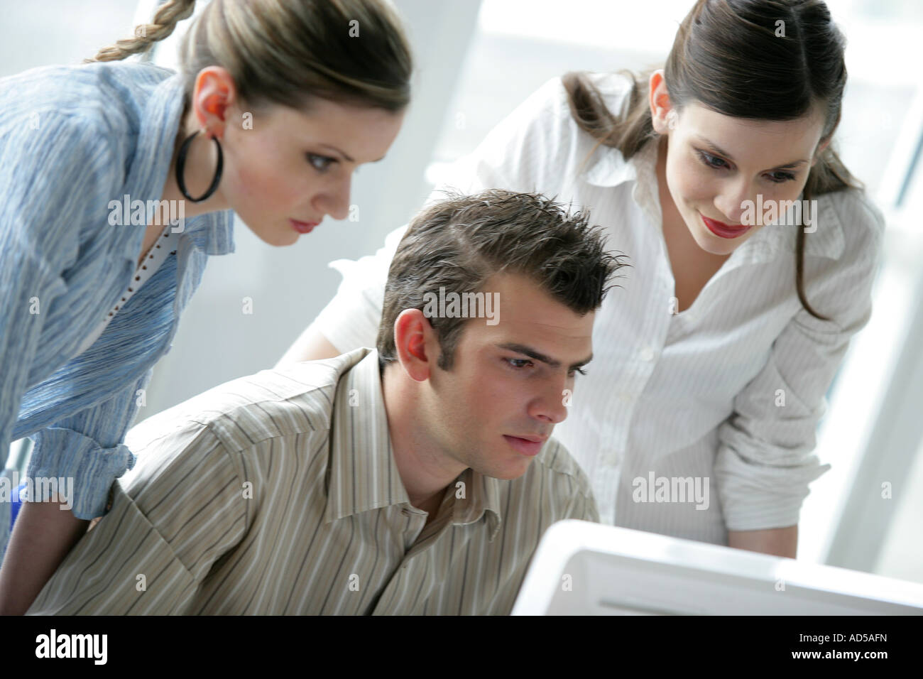 Young professionals using computers Stock Photo - Alamy