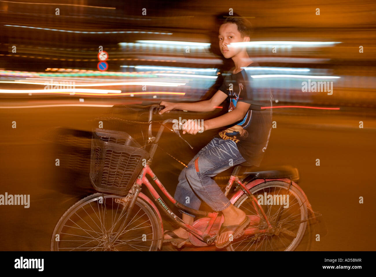 Southeast Asia Vietnam Ho Chi Minh City Blurred image of young boy ...
