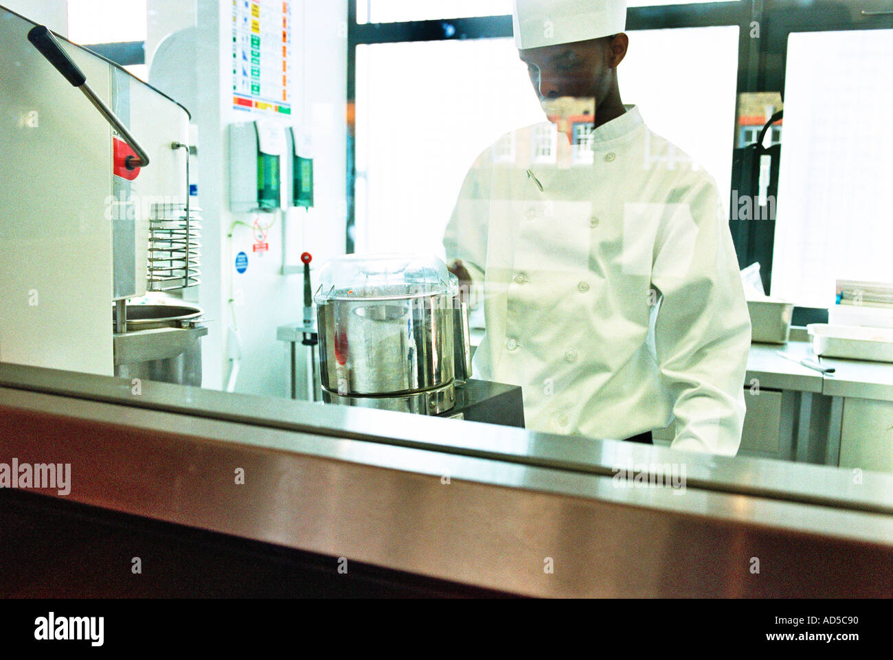 Young cook makes coffee in a cafe Stock Photo - Alamy