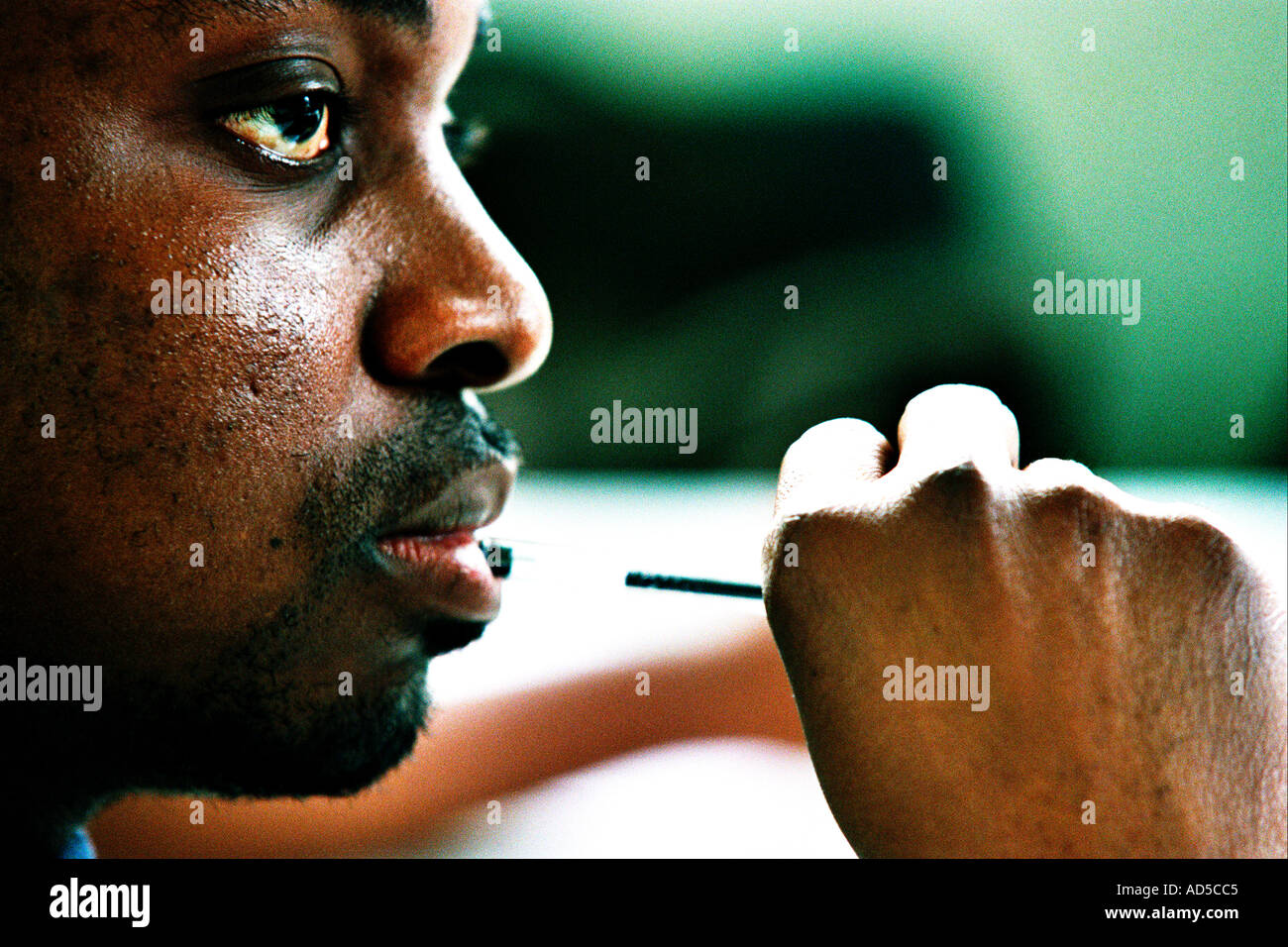 Young black male concentrating during lecture Stock Photo - Alamy
