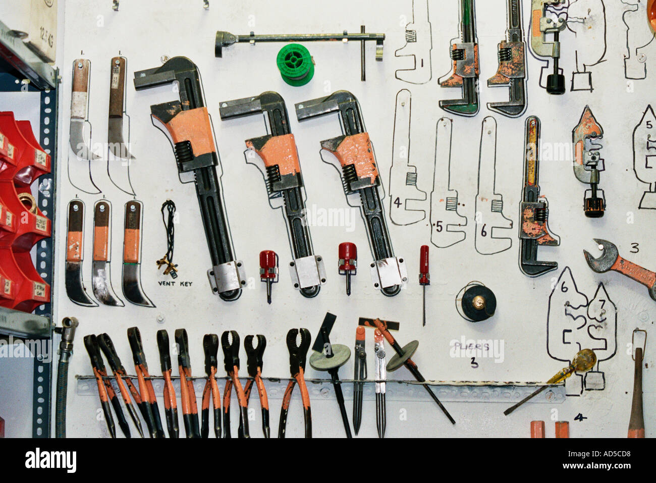 Garage tools hung on wall Stock Photo - Alamy