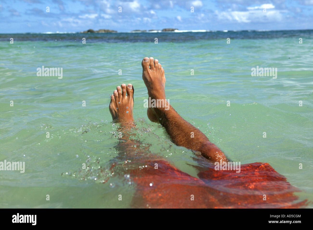 Man relaxing in the sea Stock Photo - Alamy