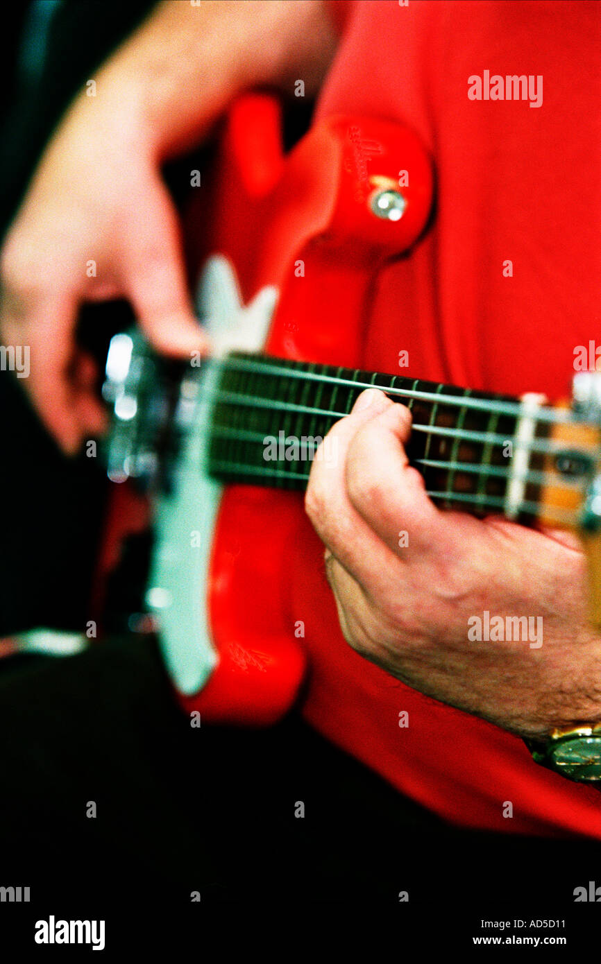 Someone playing bass guitar Stock Photo - Alamy