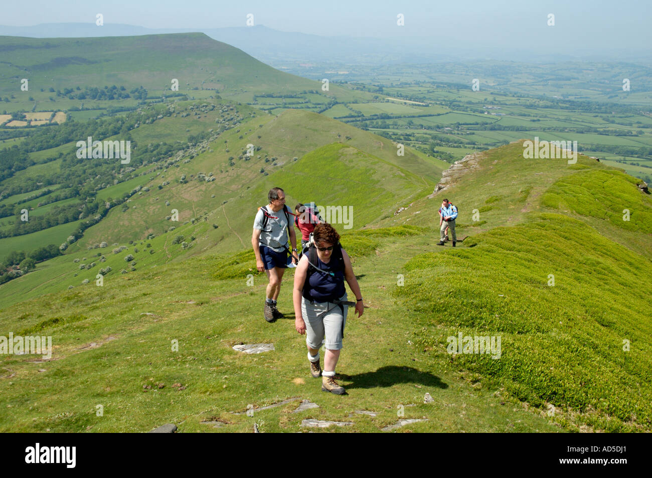 Guided walking group heading up the Dragons Back in the Black Mountains ...