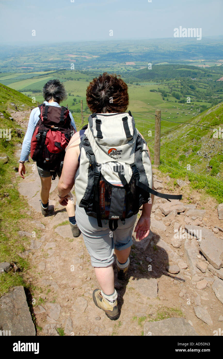 Guided walking group heading down byway at Rhiw Cwnstab in the Black ...