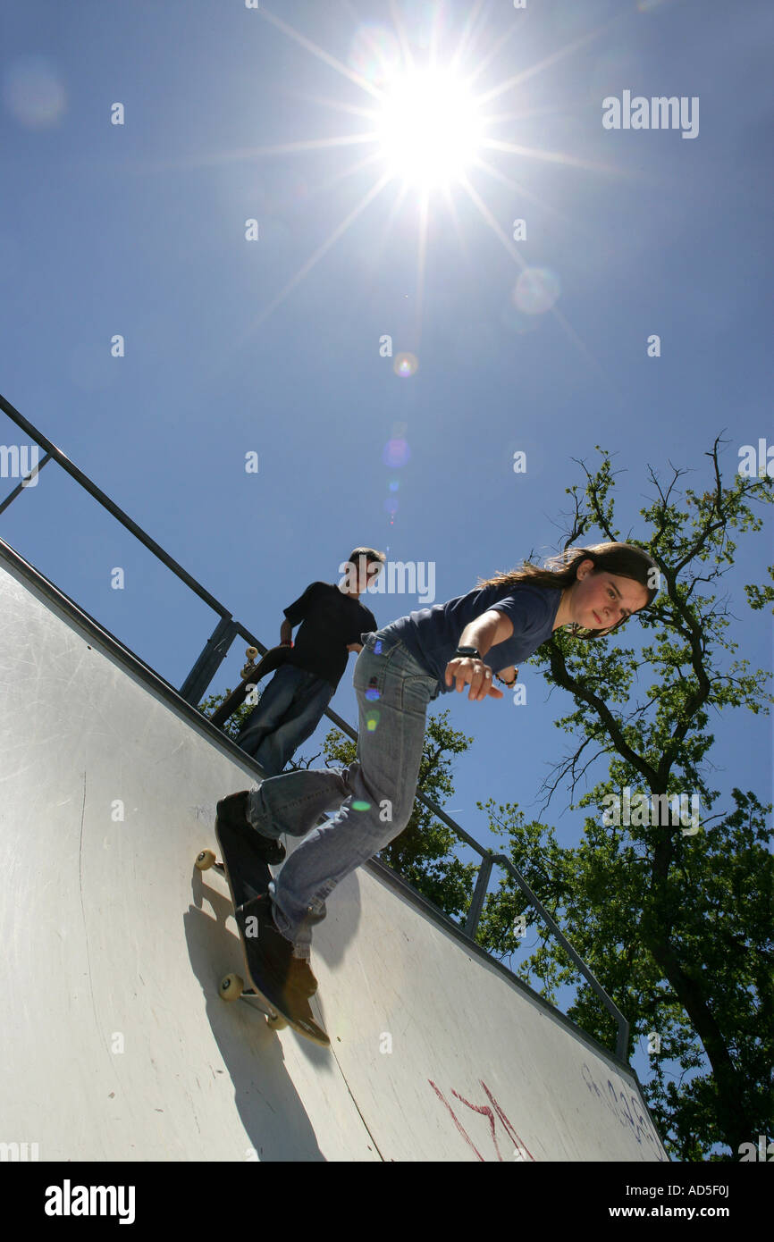 Girl skateboarding on a vertical ramp Stock Photo - Alamy