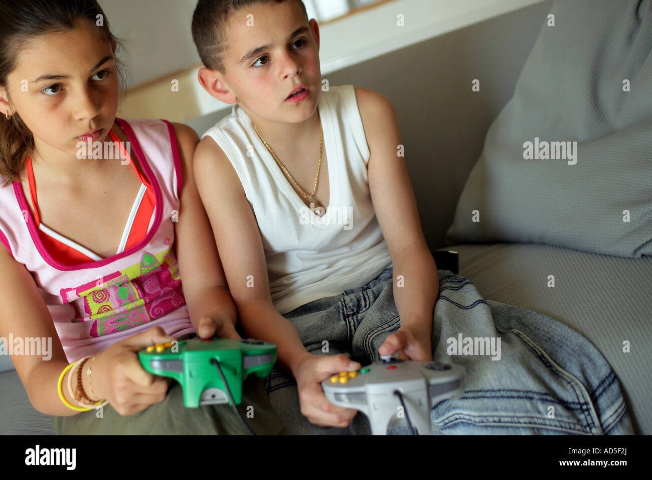 Children playing a video game Stock Photo - Alamy