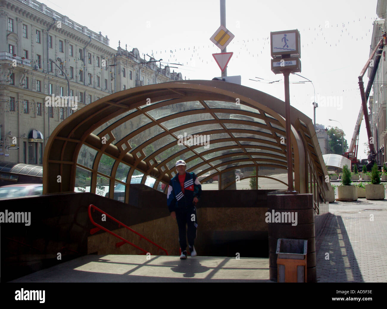 Street entrance and exit to Minsk Metro subway with man in sports ...
