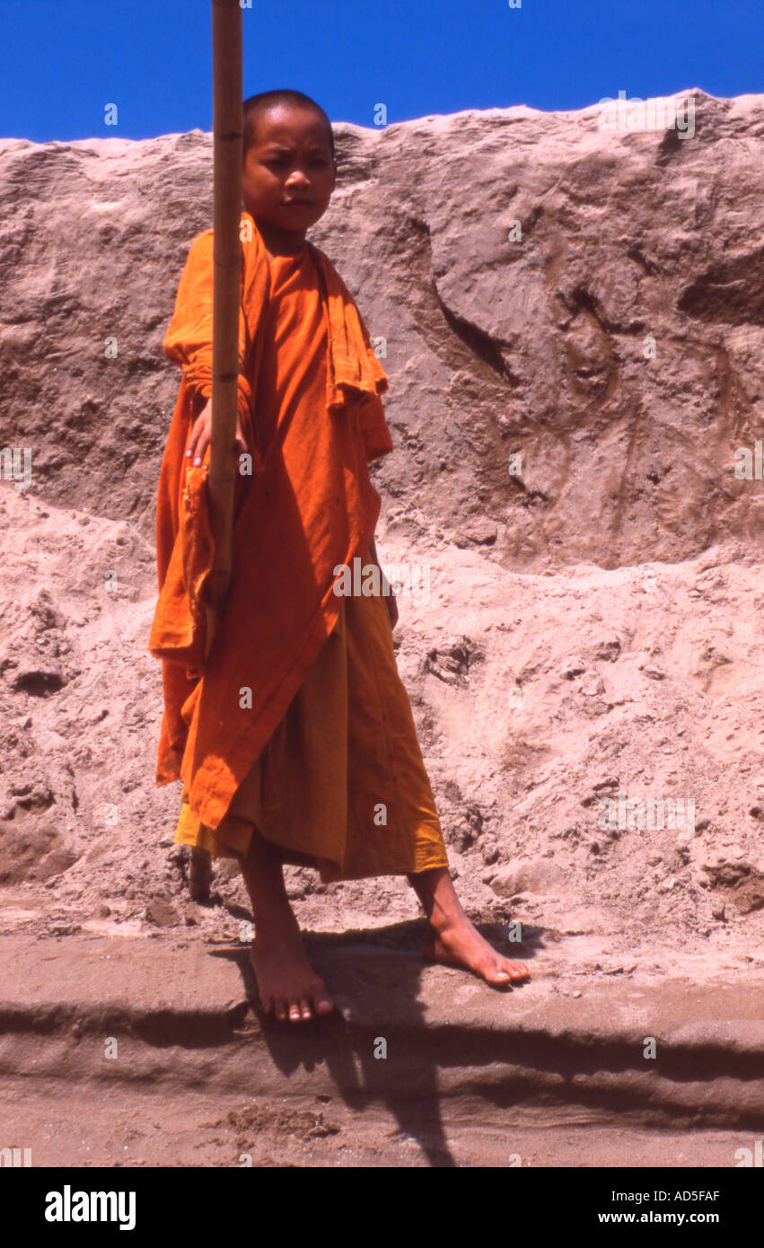 Young Buddhist monk on mekong river bank Lao Stock Photo - Alamy